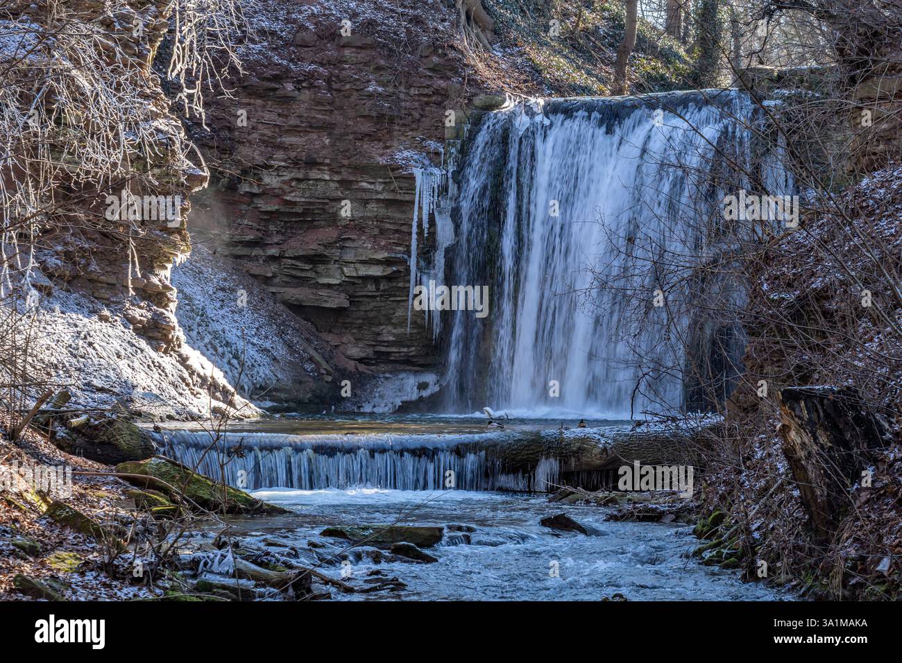 waterfall in the spa park of Heilbad Heiligenstadt, Germany on a cold ...