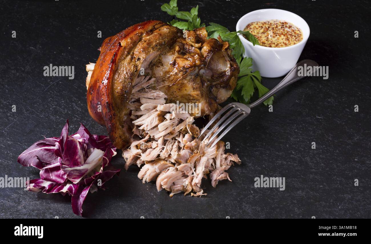 Crispy fried Bavarian pork knuckle with soft meat Stock Photo - Alamy