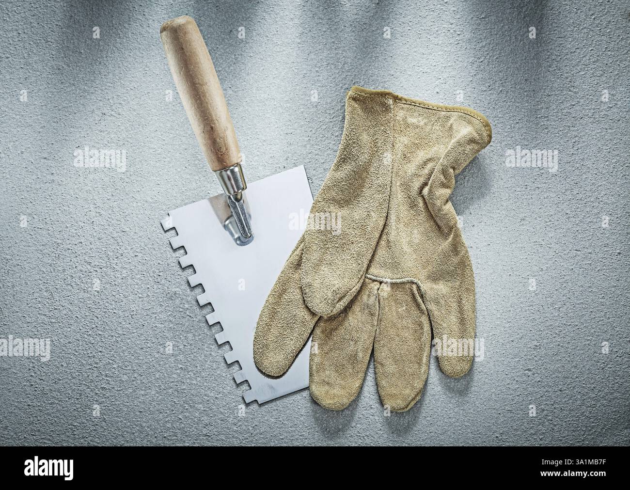 Paint scraper safety gloves on concrete surface construction concept ...