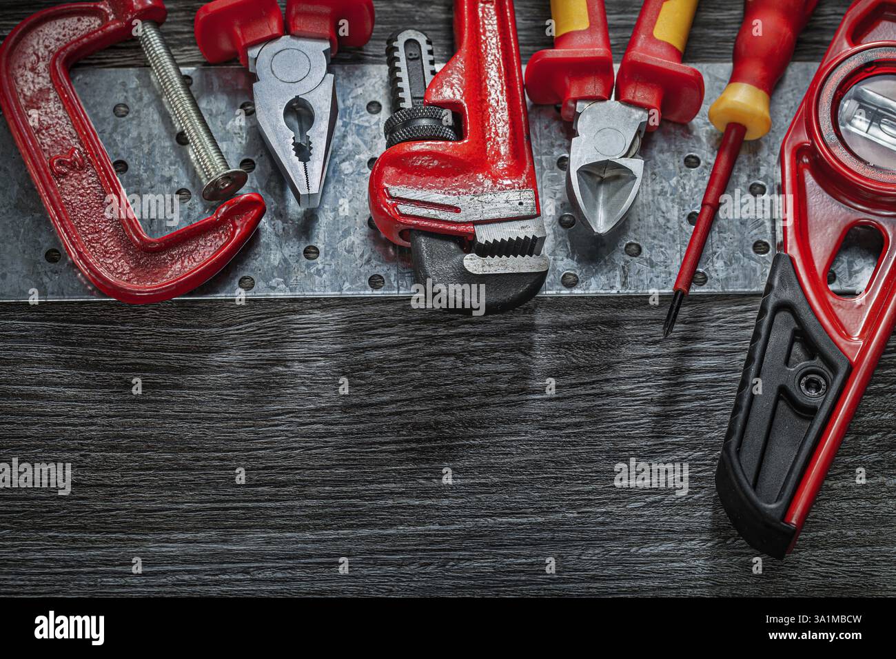 Red Construction Tools On Metalic Plate Stock Photo - Alamy