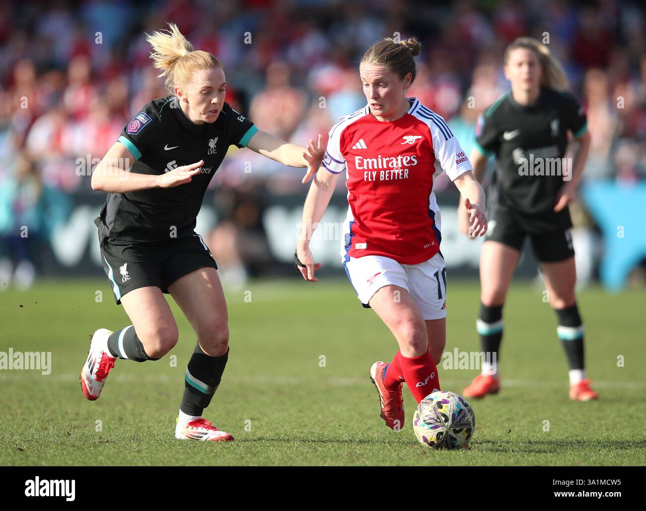 Liverpool's Ceri Holland (left) and Arsenal's Kim Little battle for the ...