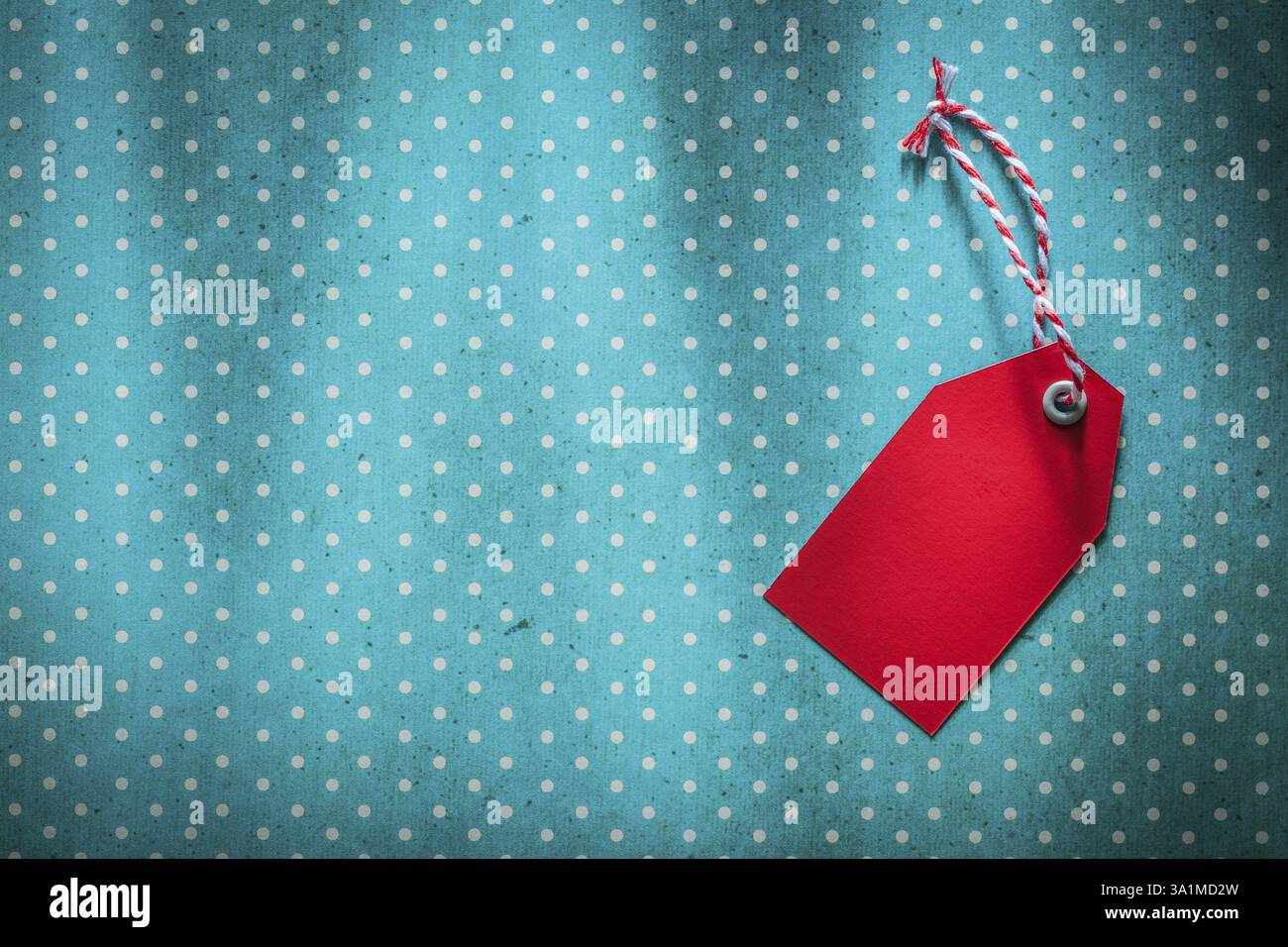 Price tag on blue polka-dot background Stock Photo - Alamy