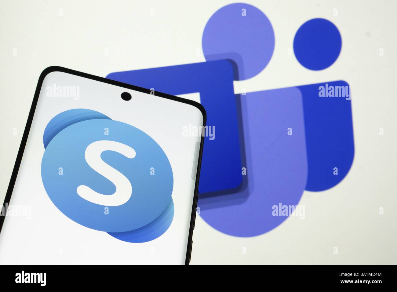 Skype logo is displayed on a smartphone screen, with the microsoft ...