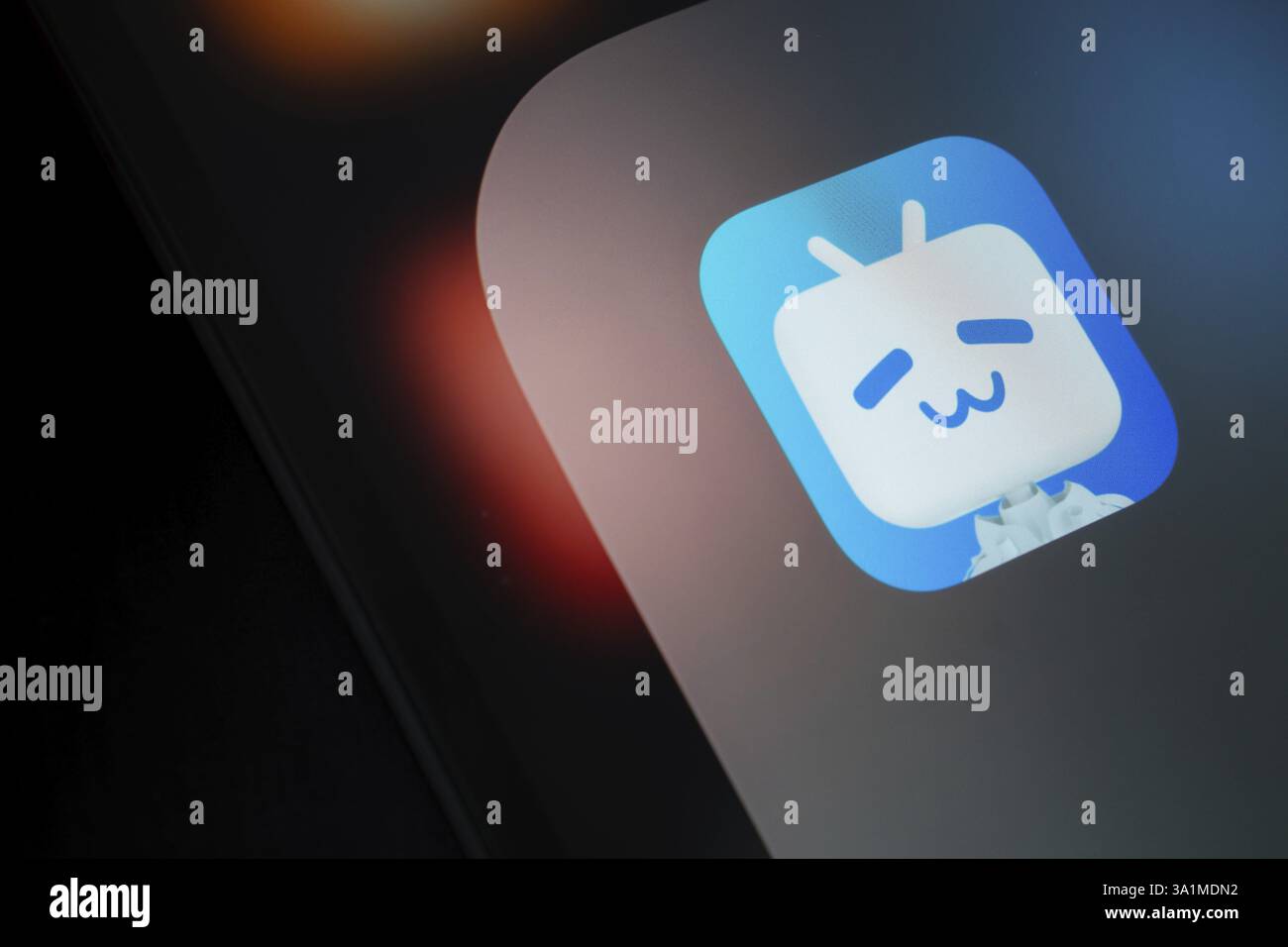 A close up of an iPad screen displaying the bilibili app Stock Photo ...