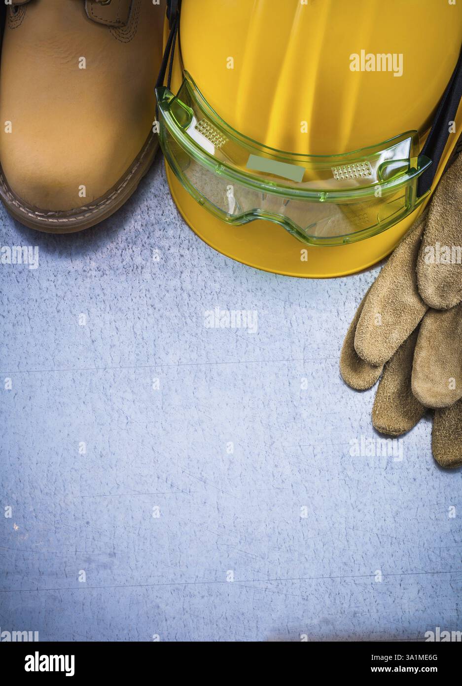 Pair of leather gloves safety shoes building helmet and transparent ...