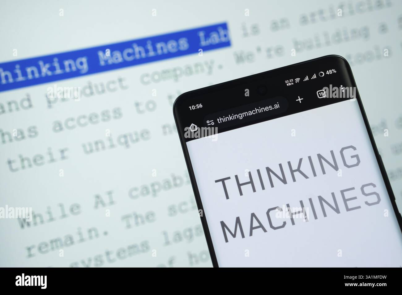 Thinking Machines Lab homepage on the smartphone screen. Thinking ...