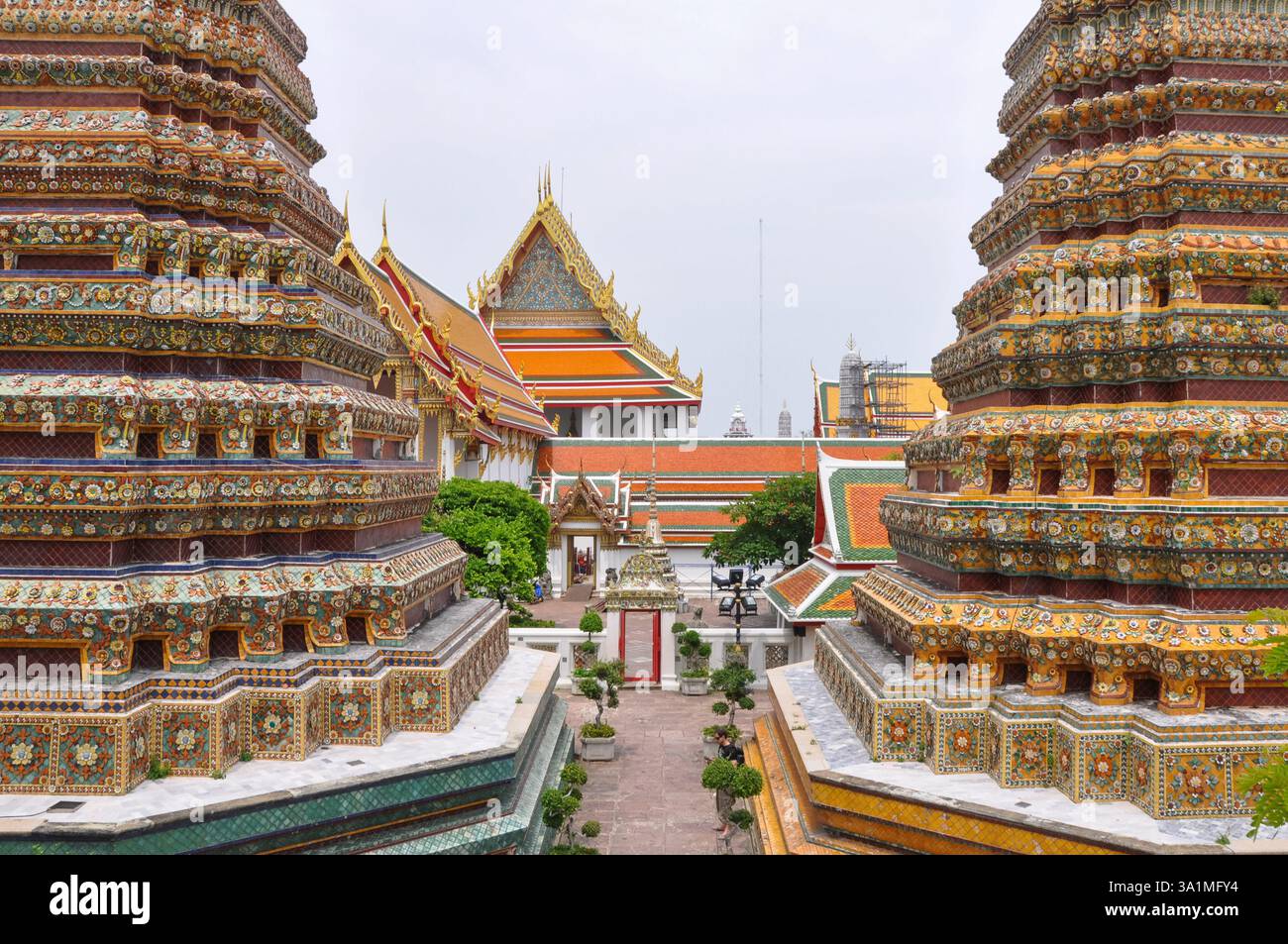 Bangkok, Thailand - May 4, 2009: Two intricately decorated stupas at ...