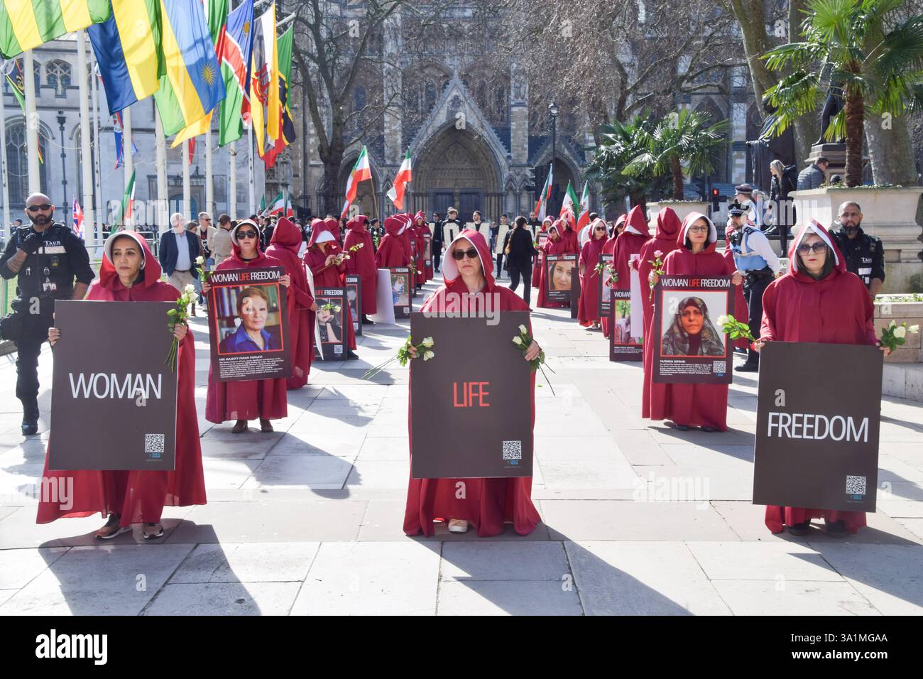 London, UK. 8th March 2025. Women wearing The Handmaid's Tale costumes ...