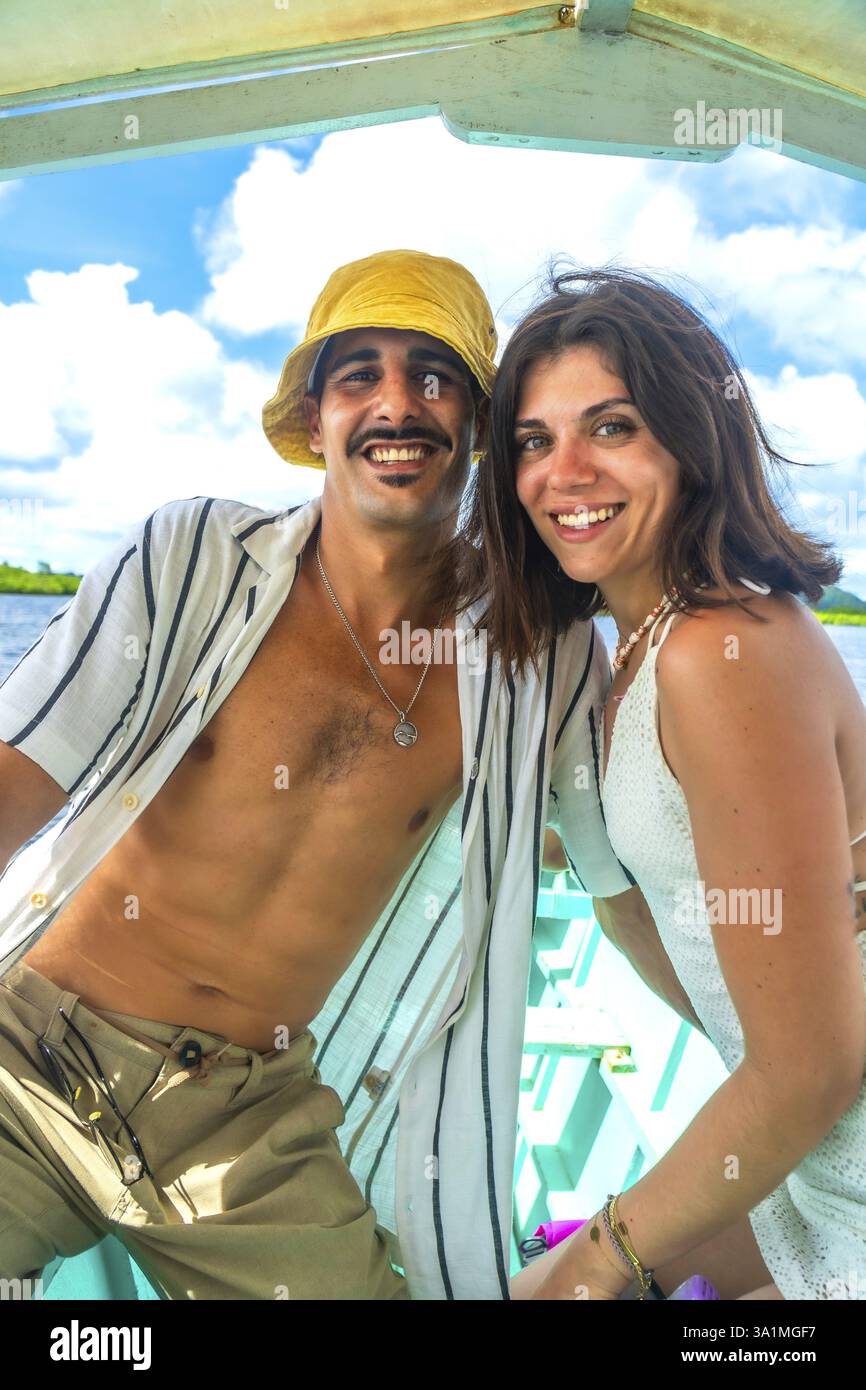 Happy couple smiling during a boat trip in siargao island, philippines ...