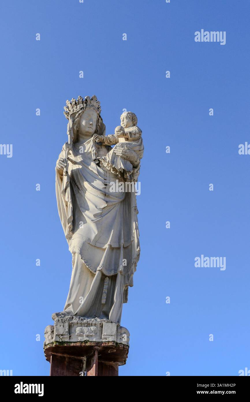 Paris France, March 6, 2025. Notre Dame. Statue of the Virgin Mary on ...