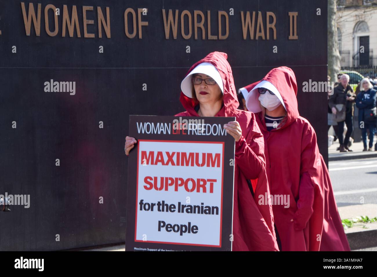 London, UK. 8th March 2025. Women wearing The Handmaid's Tale costumes ...