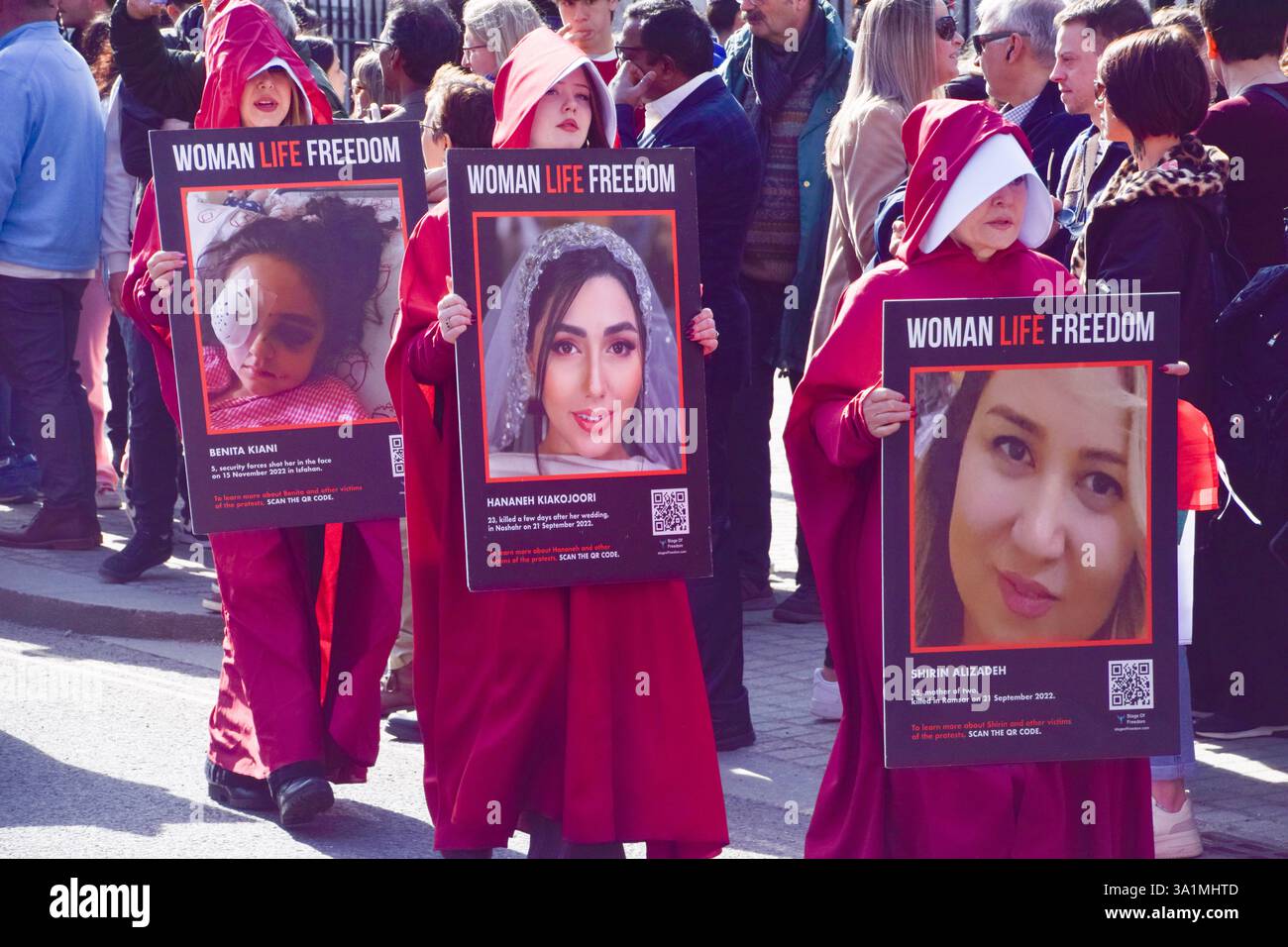 London, UK. 8th March 2025. Women wearing The Handmaid's Tale costumes ...