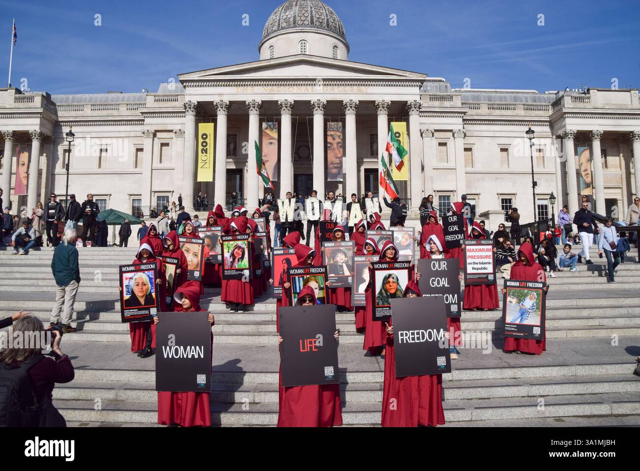 London, UK. 8th March 2025. Women wearing The Handmaid's Tale costumes ...