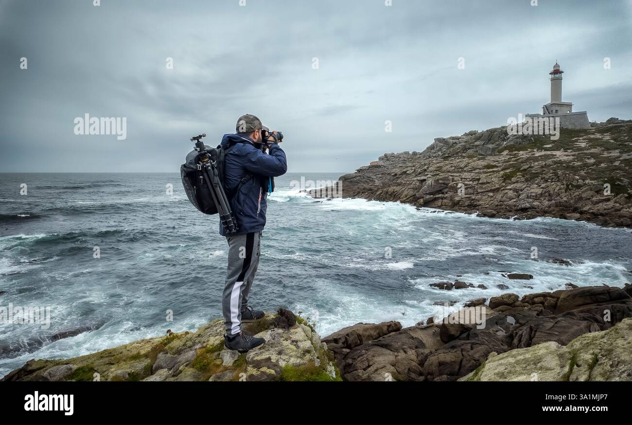 Taking photos at Punta Nariga Lighthouse Stock Photo - Alamy