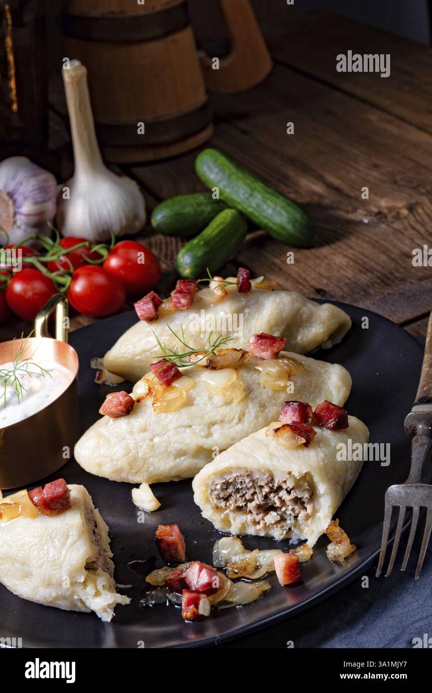 Rustic Cepelinai, a specialty Lithuanian and Polish cuisine Stock Photo ...
