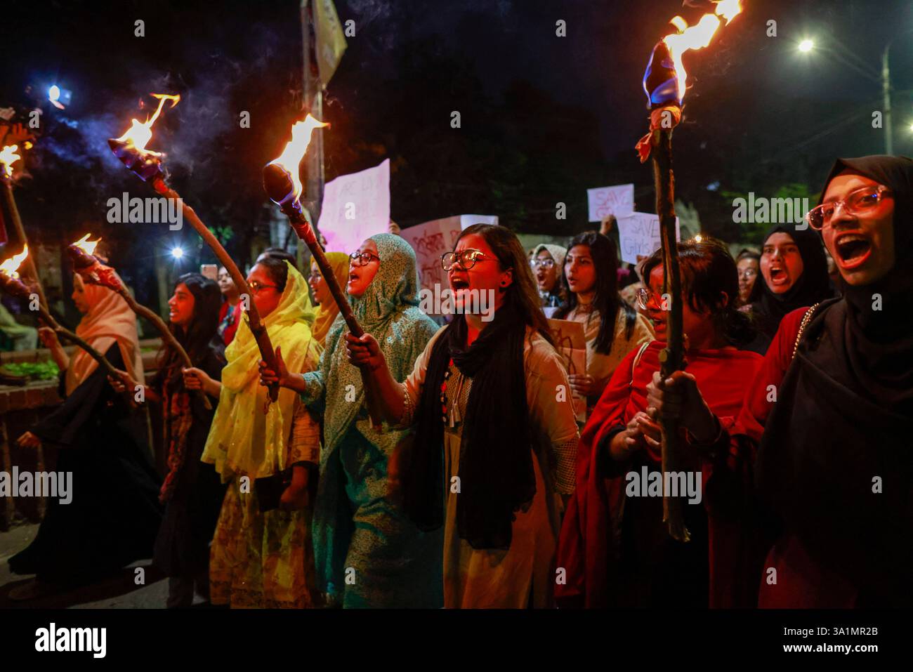Students at Dhaka University's Rokeya Hall marched with placards and ...