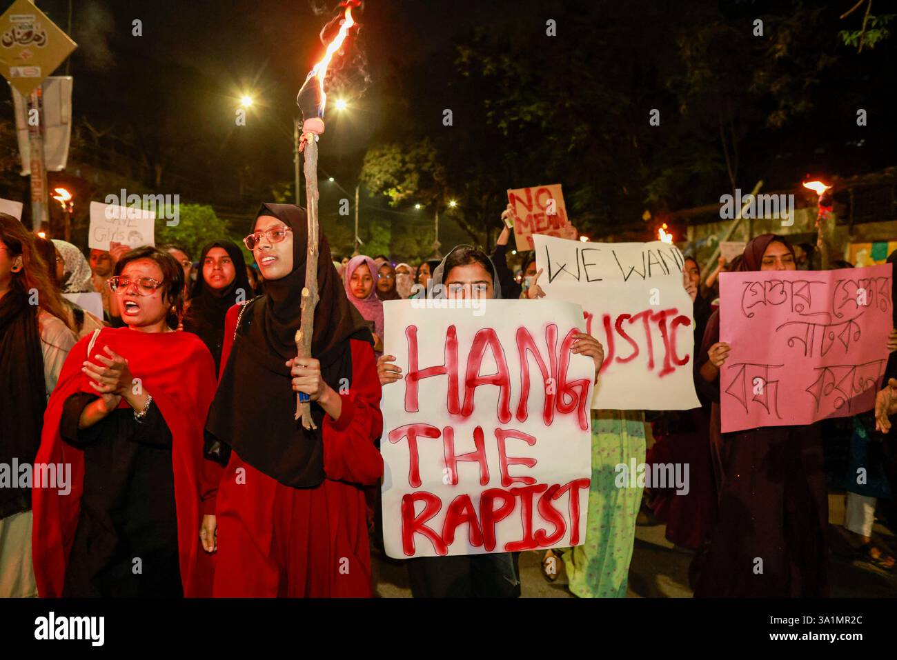 Students at Dhaka University's Rokeya Hall marched with placards and ...