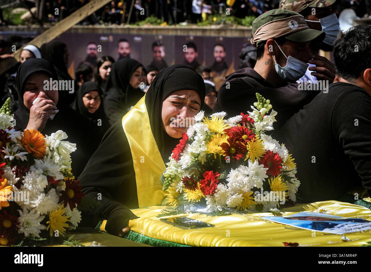 09 March 2025, Lebanon, Kfarkela: A Shia Muslim woman mourns over the ...