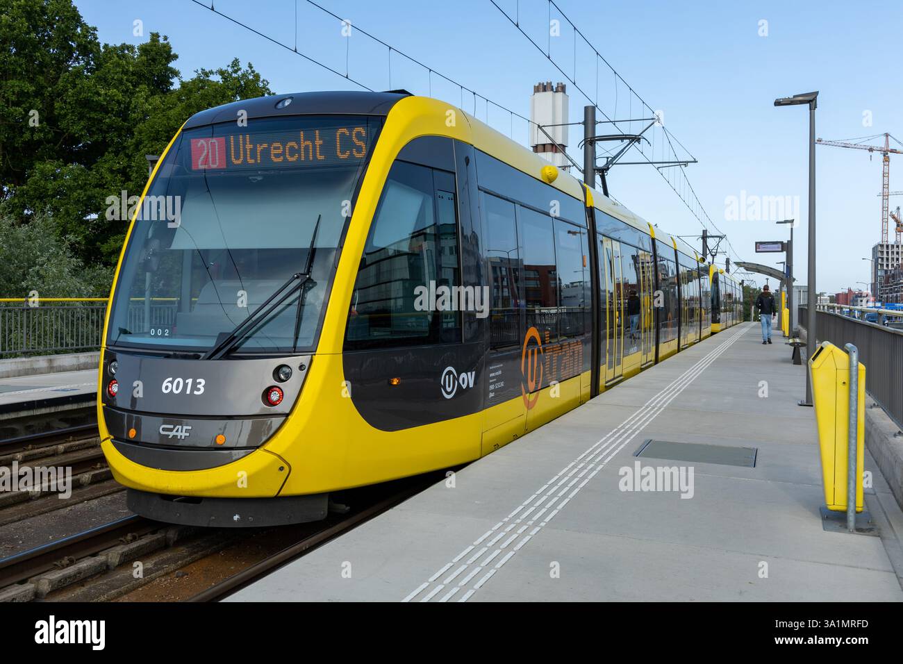 Tram In Nieuwegein driving on a bridge at station Merwestein with ...