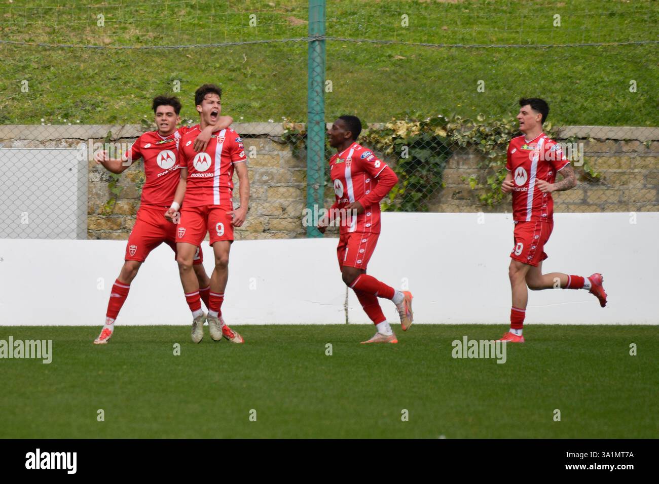 Jordan Longhi (AC Monza) celebrates with his teammate after scoright he ...