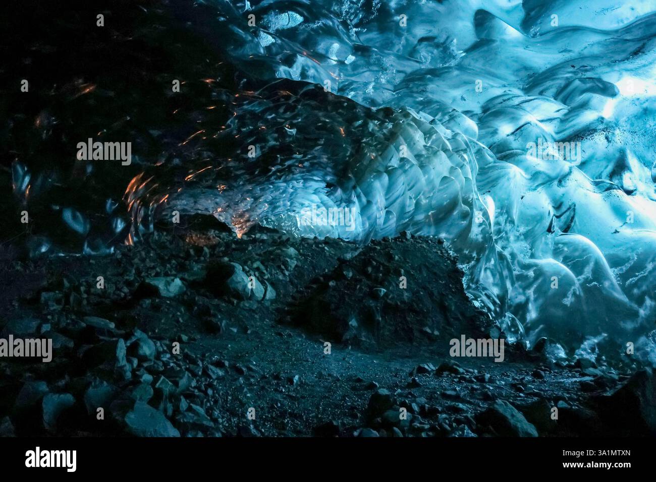 Stunning blue ice formations create a mesmerizing spectacle inside a ...