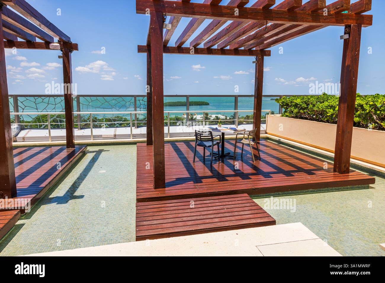 Luxury rooftop hotel terrace with wooden pergola and infinity pool ...
