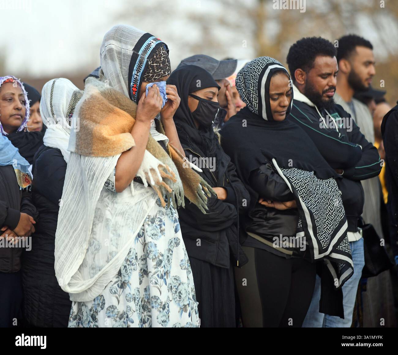 People attend a vigil on Danes Drive Park in Glasgow for Eritrean ...