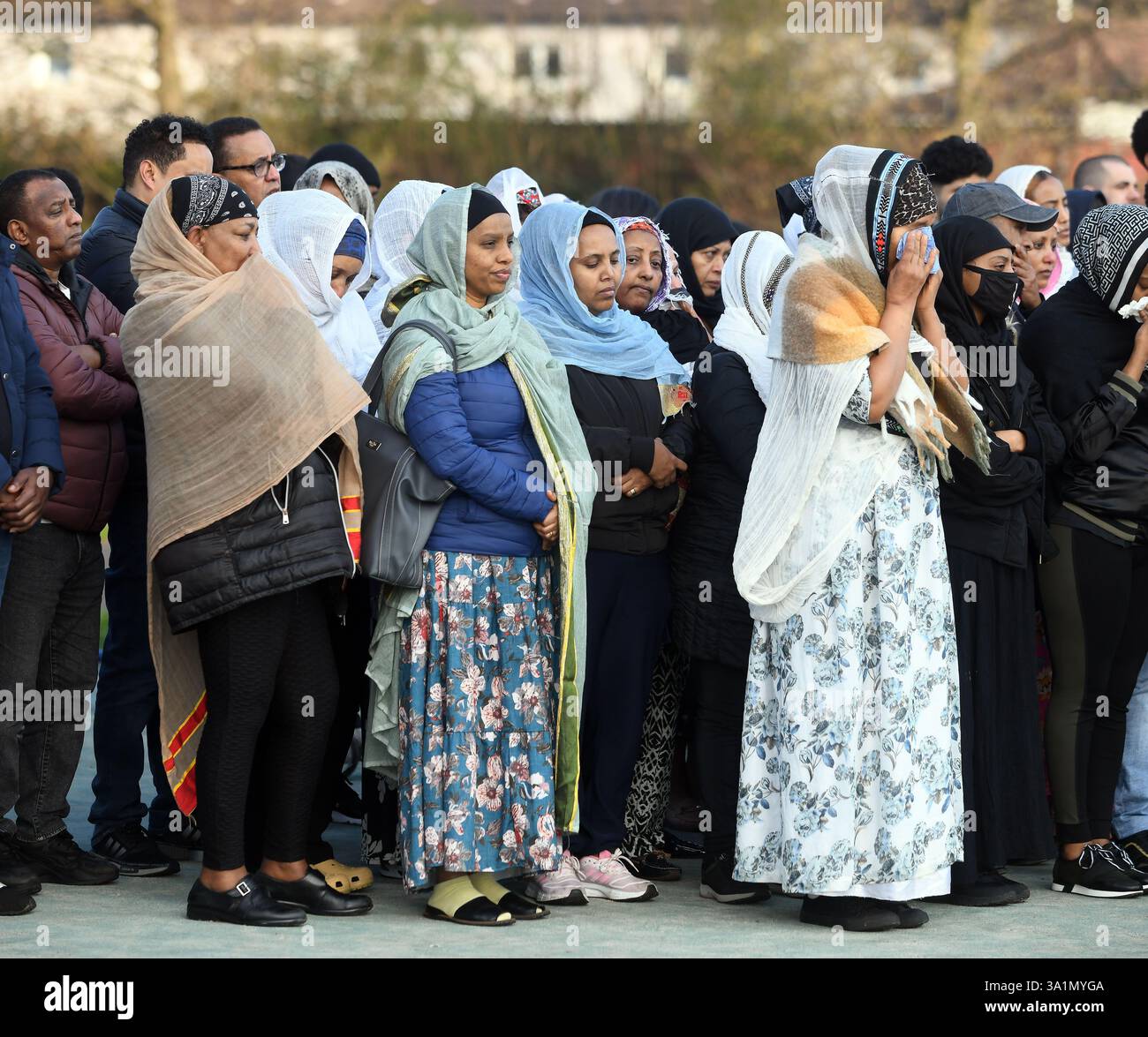 People attend a vigil on Danes Drive Park in Glasgow for Eritrean ...