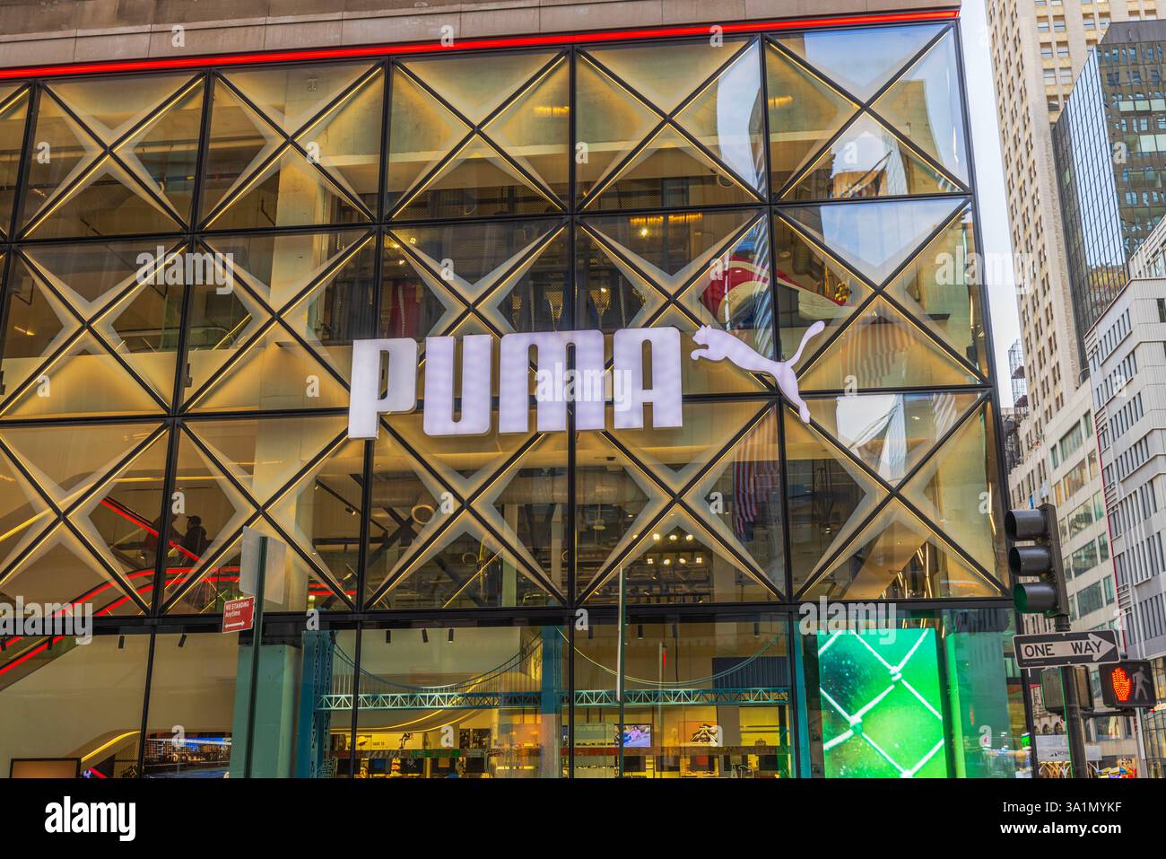 Puma store facade with illuminated logo and glass design in New York ...