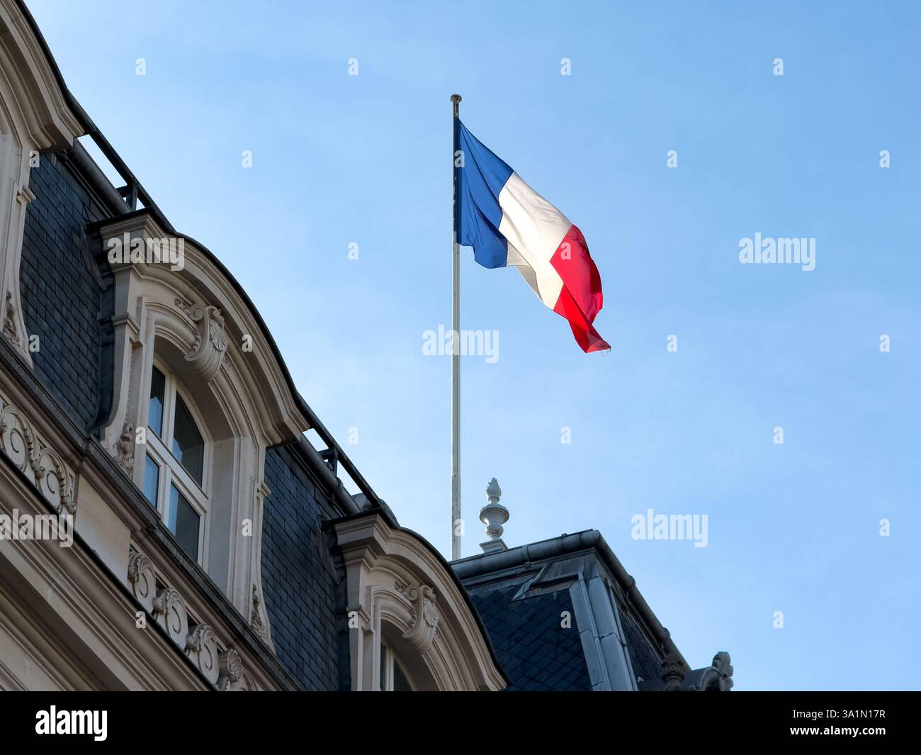 French flag waving on building in France, Paris Stock Photo - Alamy