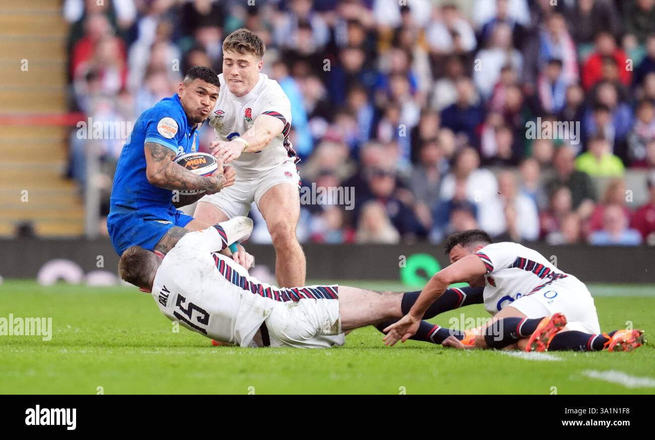 Italy's Monty Ioane is tackled by England's Elliot Daly (on floor ...
