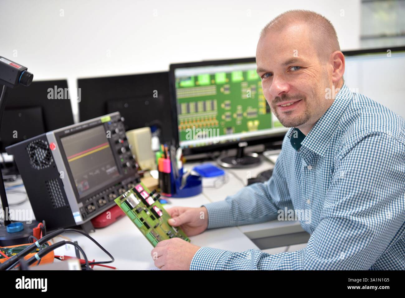 engineer at the workplace - assembly and development of electronics in ...