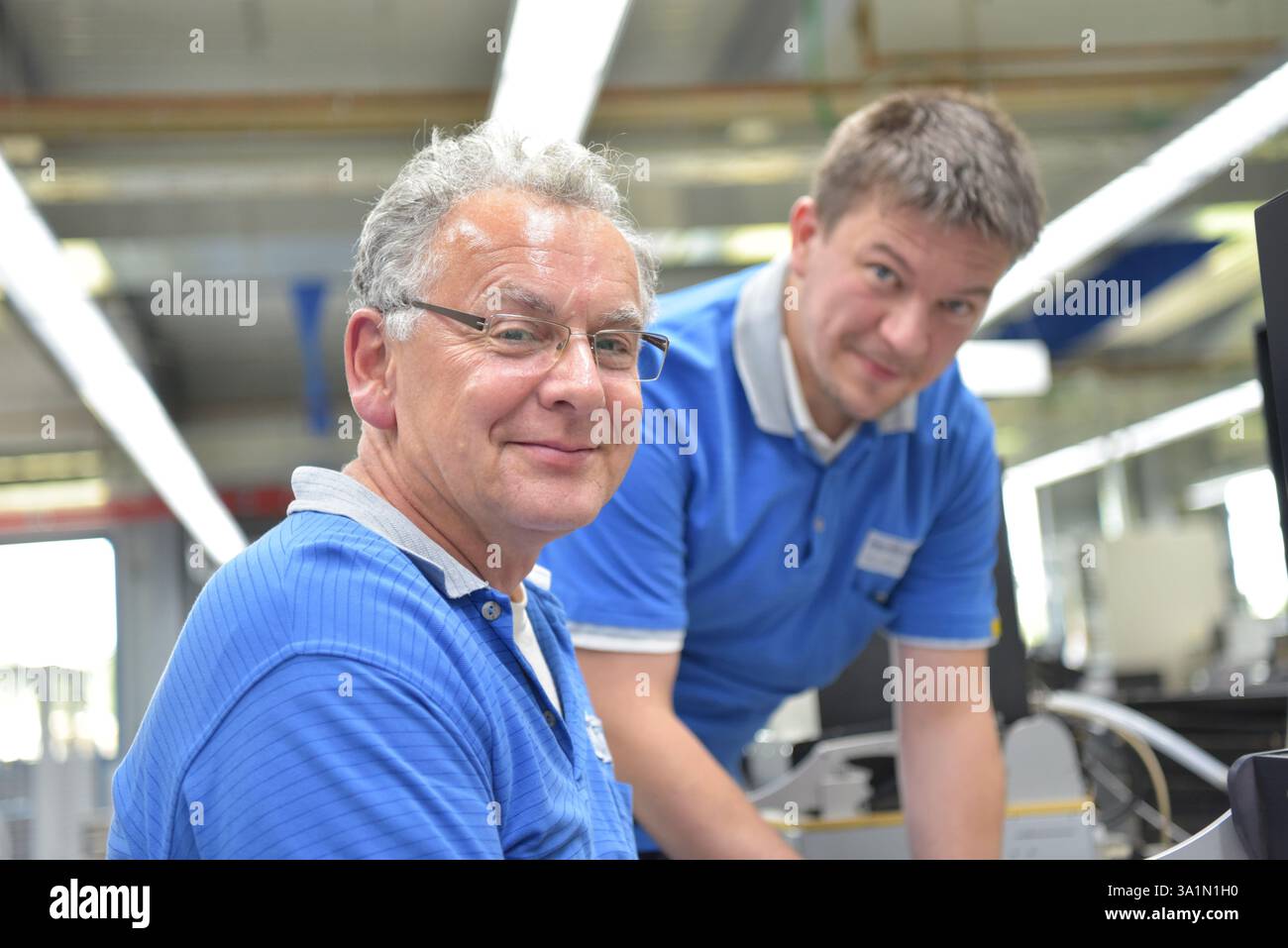 engineer working on a machine for assembly and production of ...