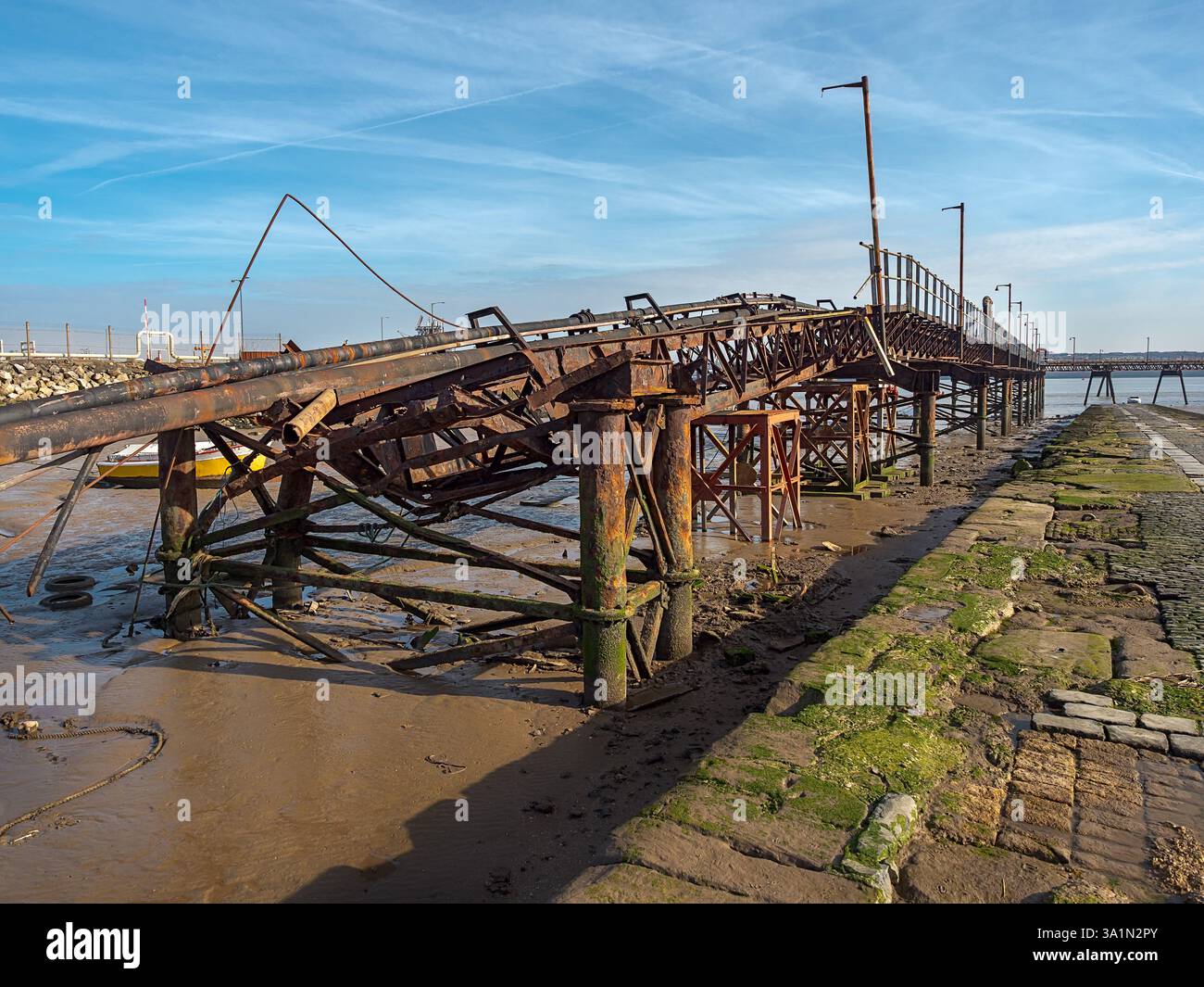 A pier has been destroyed and is now a pile of wood and metal . The ...