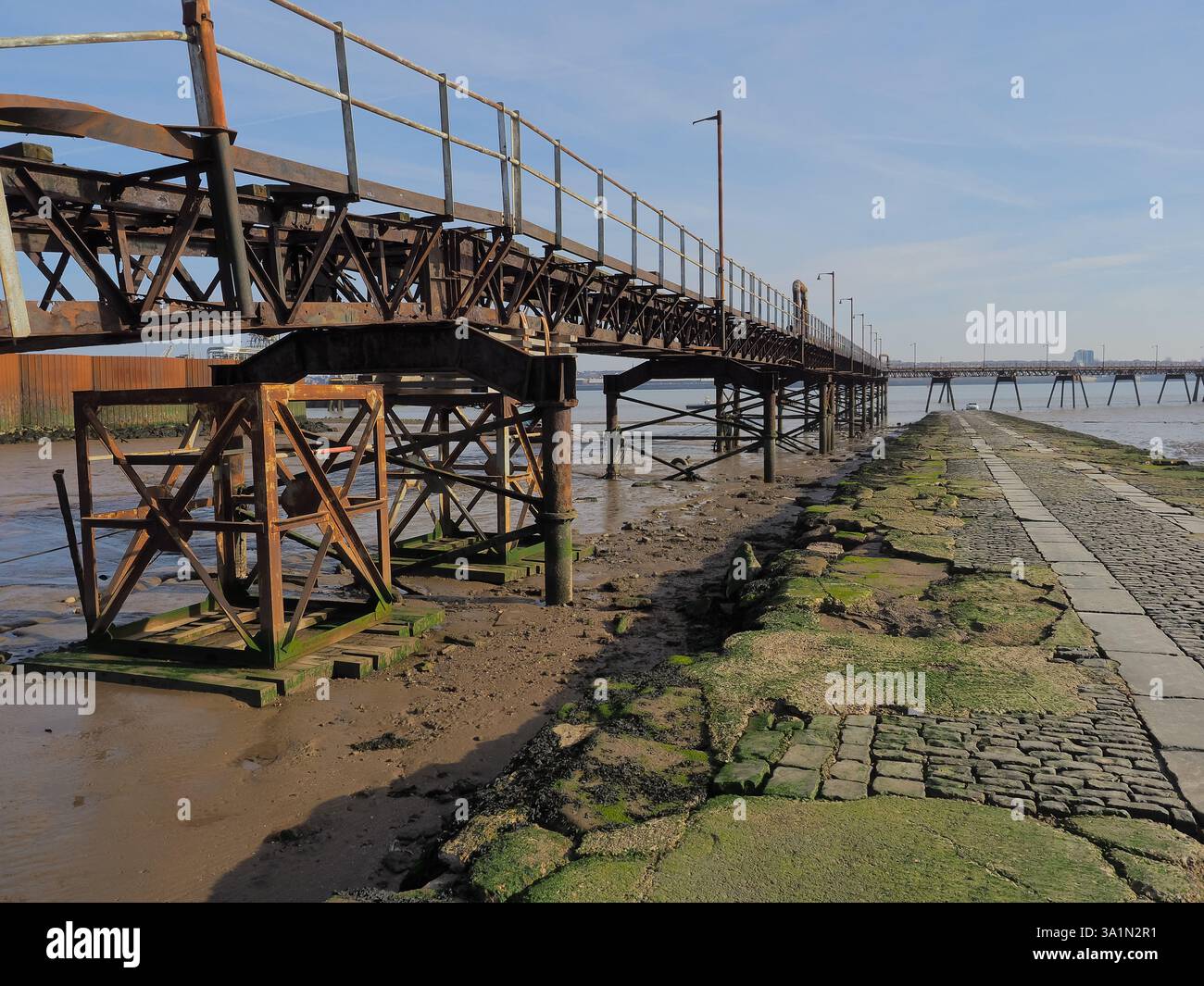 A pier has been destroyed and is now a pile of wood and metal . The ...