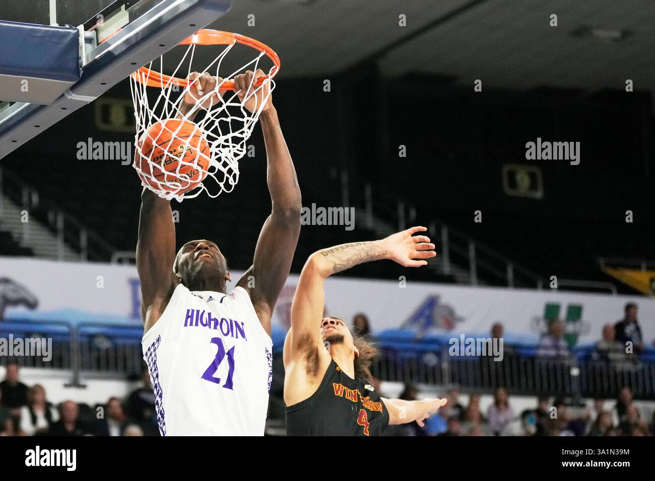 High Point forward Juslin Bodo Bodo (21) dunks the ball over Winthrop ...