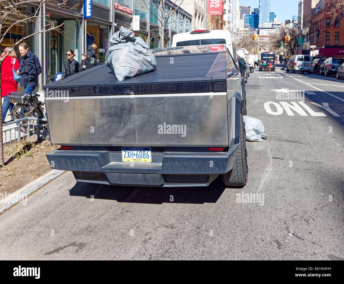 Garbage bag tossed on a Tesla Cybertruck in the aftermath of the ...