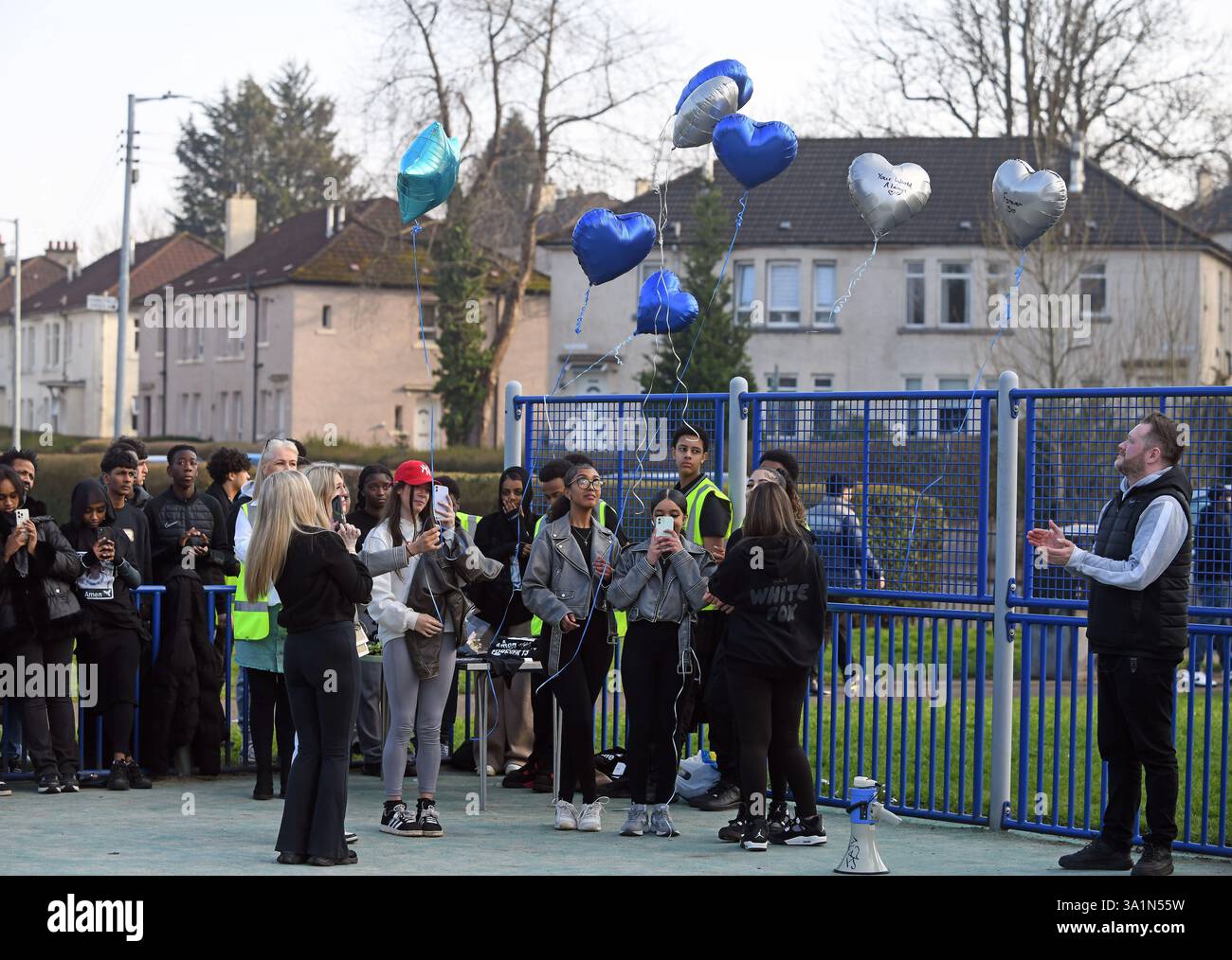 People attend a vigil on Danes Drive Park in Glasgow for Eritrean ...