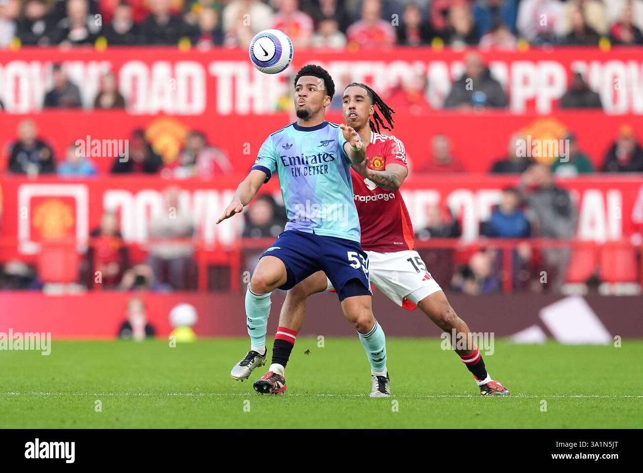 Arsenal's Ethan Nwaneri (left) and Manchester United's Leny Yoro battle ...
