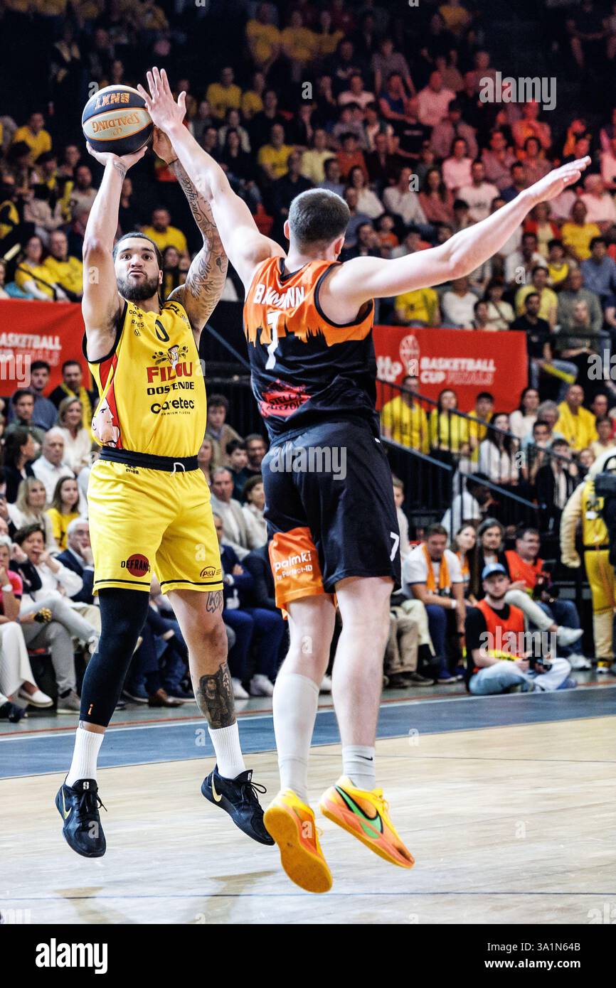 Oostende's Timmy Allen and Leuven's Noah Bauman fight for the ball during a basketball match ...