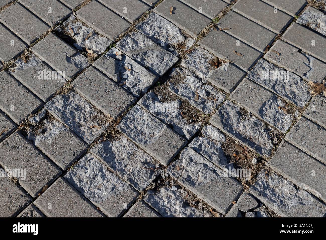 damaged and destroyed concrete tiles in the park Stock Photo - Alamy
