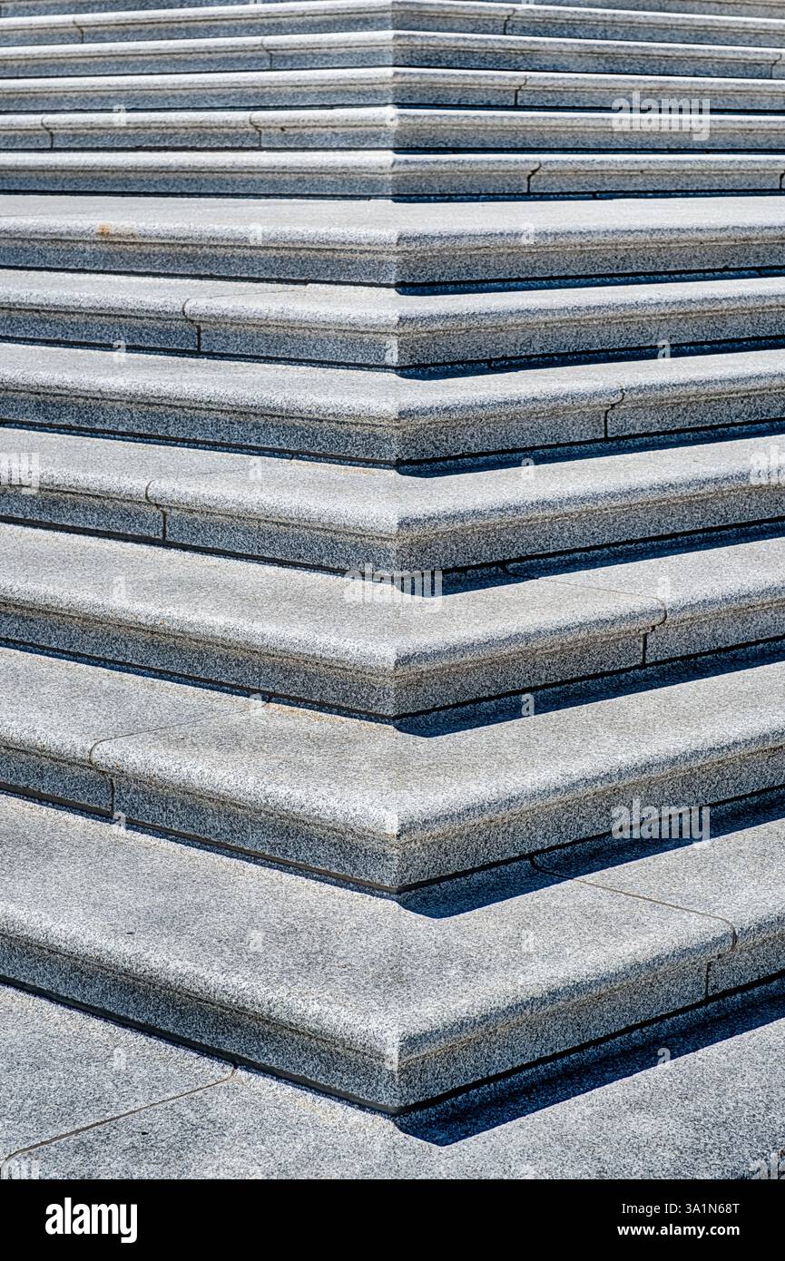 Steps at the US Capitol building in bright sunlight create an ...