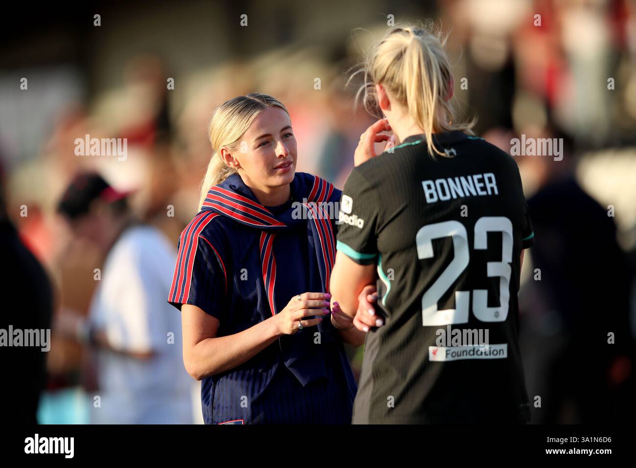 Arsenal's Chloe Kelly (left) at the end of the game speaking to ...