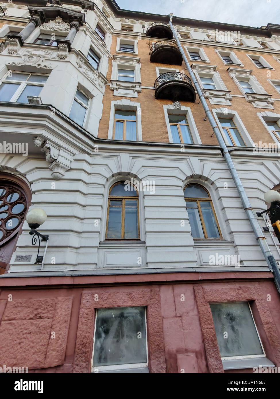 A historic building with ornate stone details, balconies, and an ...