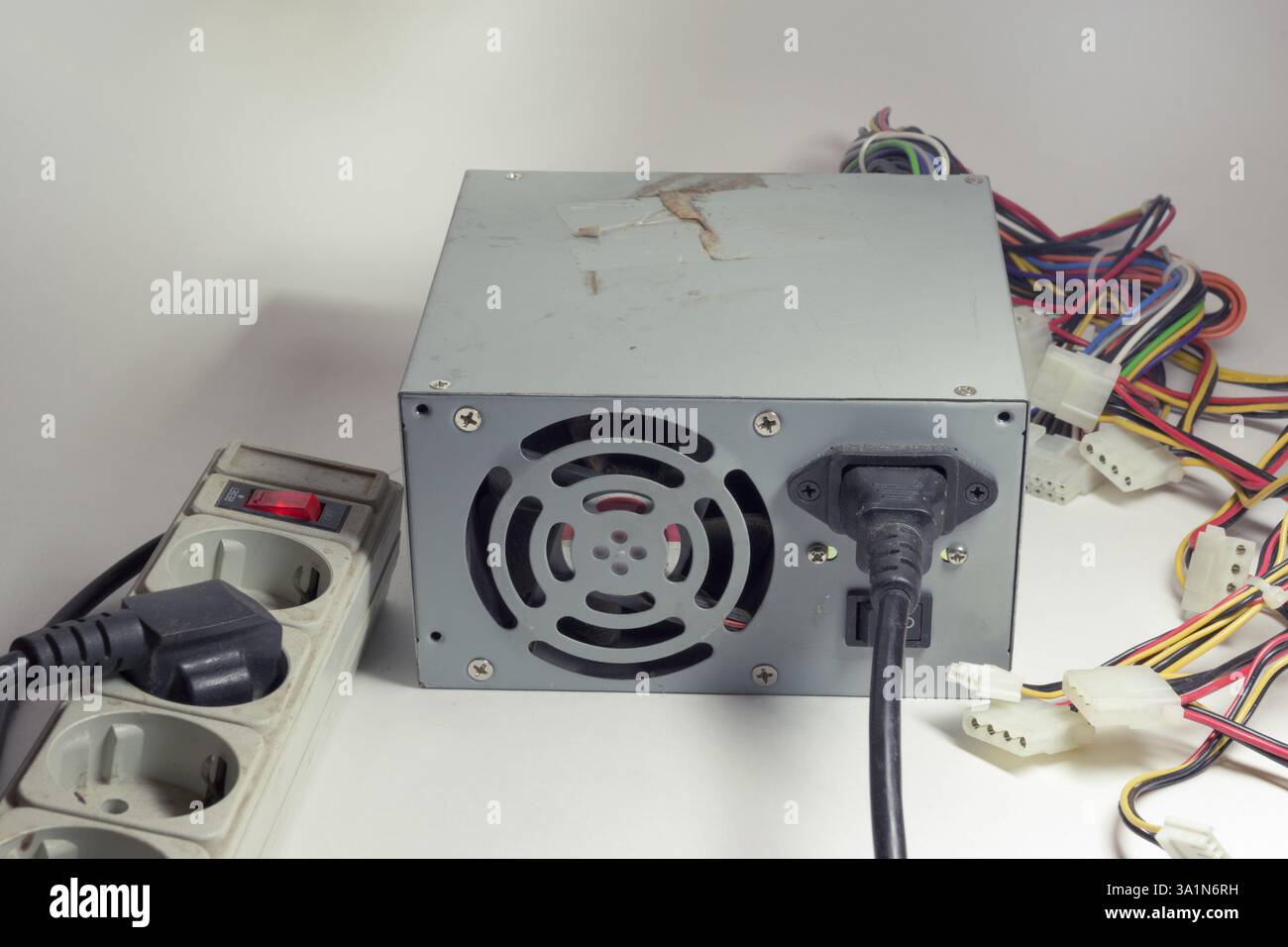 computer ATX non-modular power supply unit, with connected power cord ...