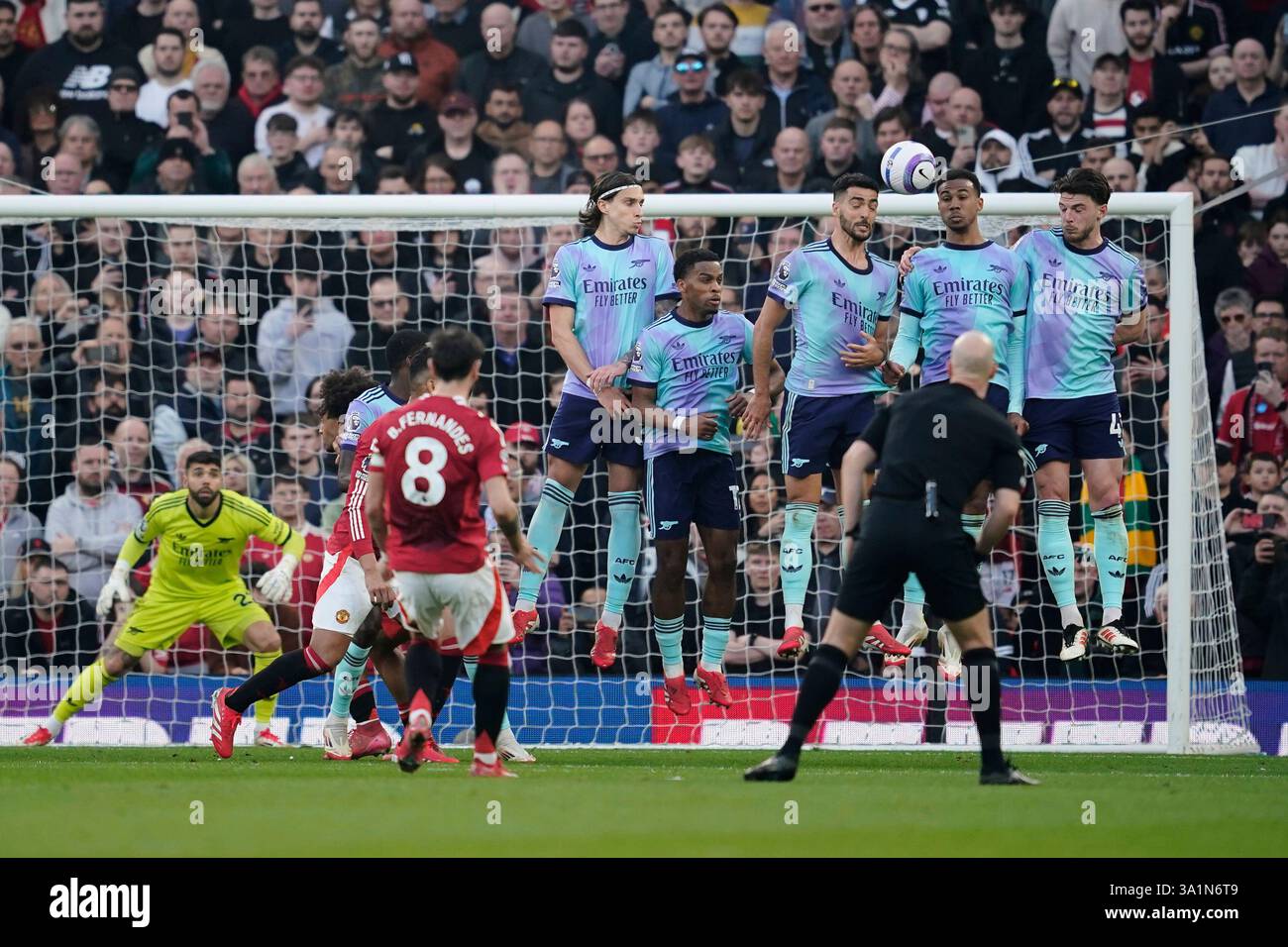 Manchester United's Bruno Fernandes (8) scores his side's opening goal ...