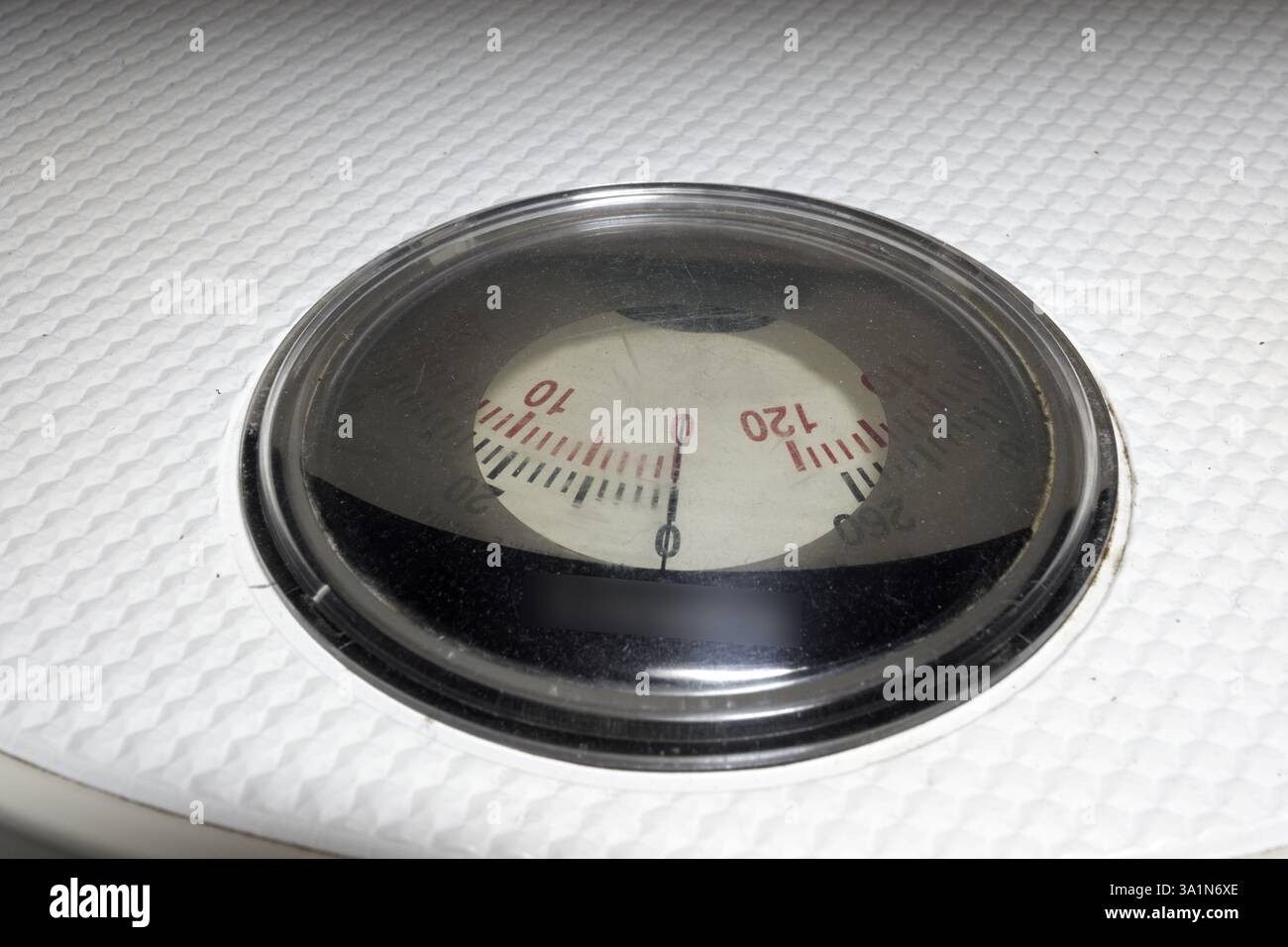 rotating measuring scale of analog bathroom scales with white ribbed ...