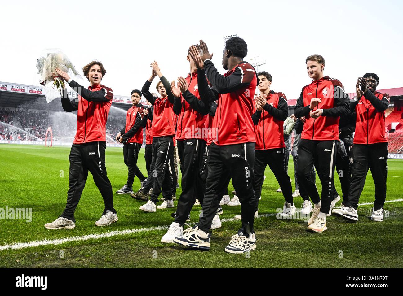 Antwerp's U16 players celebrate after winning the title before a soccer match between Royal ...