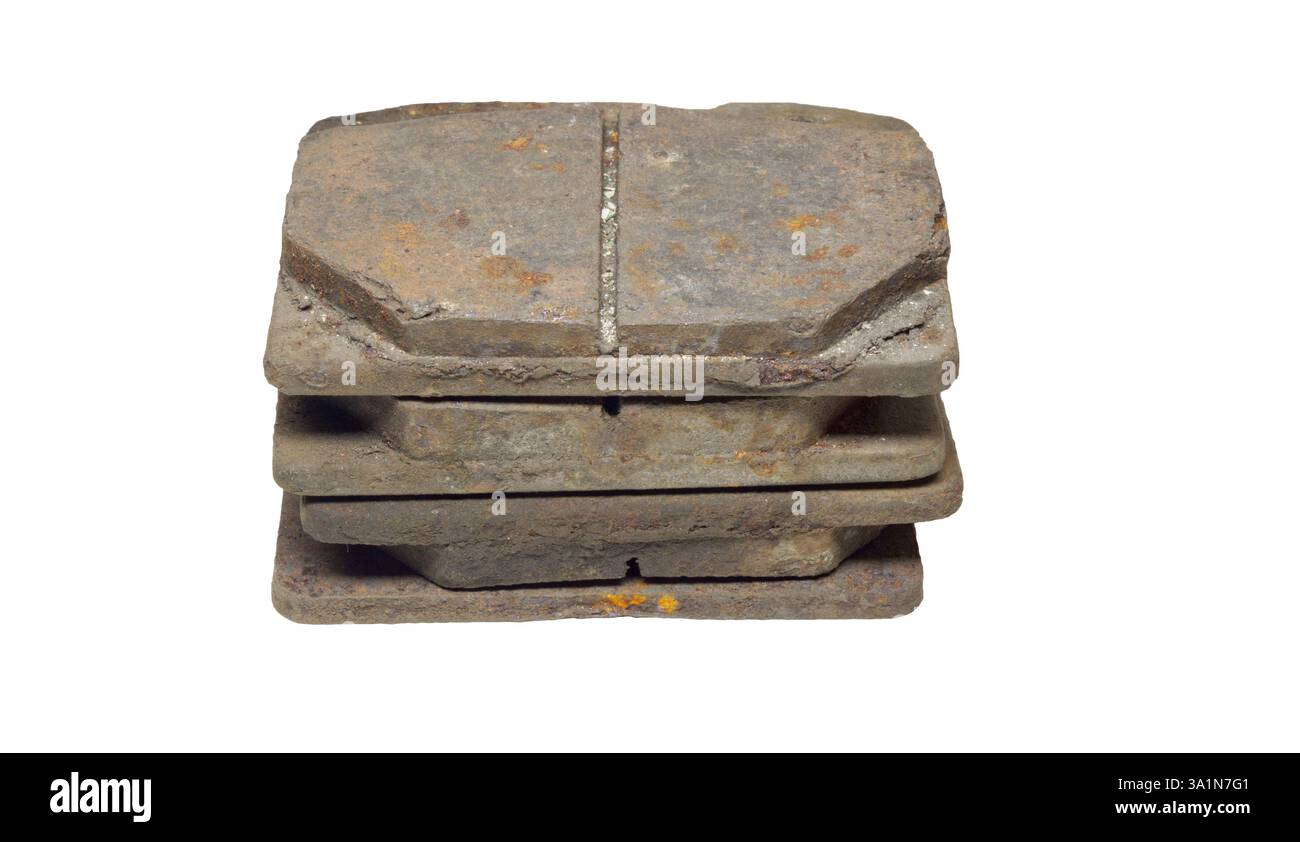 pile of worn and rusty brake pads dismantled from car. isolated on ...
