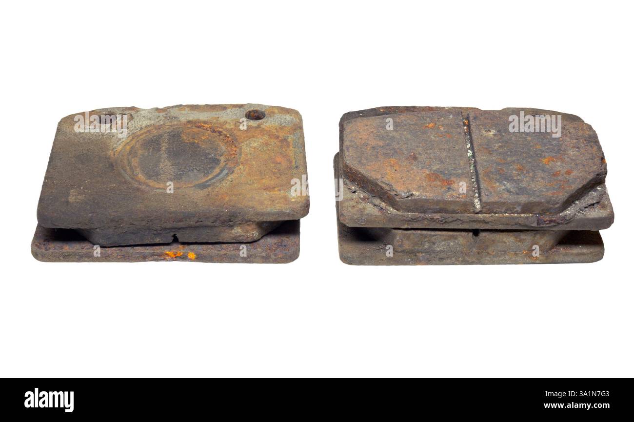 set of old worn and rusty brake pads dismantled from car. isolated on ...